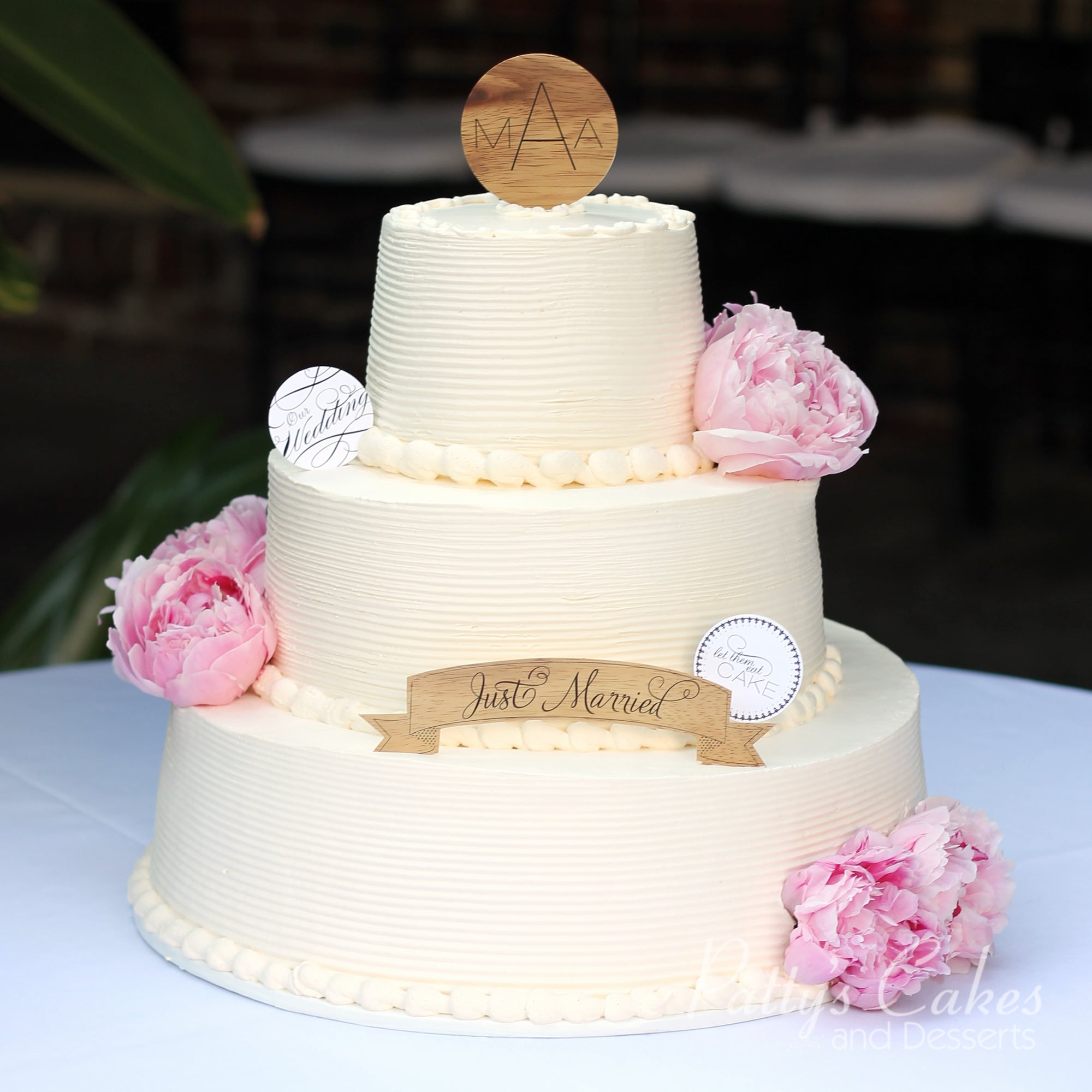 Photo of a off white combed wedding cake - Patty's Cakes and Desserts
