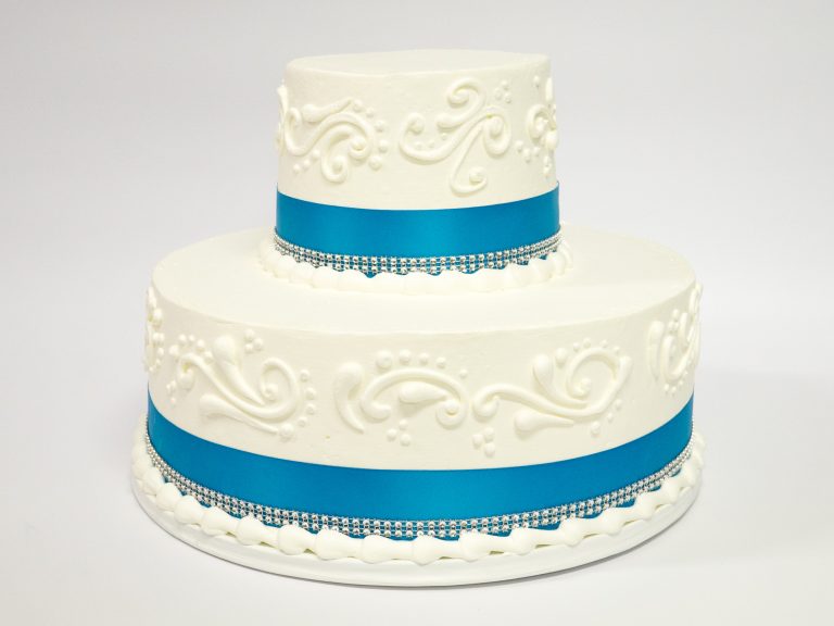 Photo of a white blue 2 tier cake - Patty's Cakes and Desserts